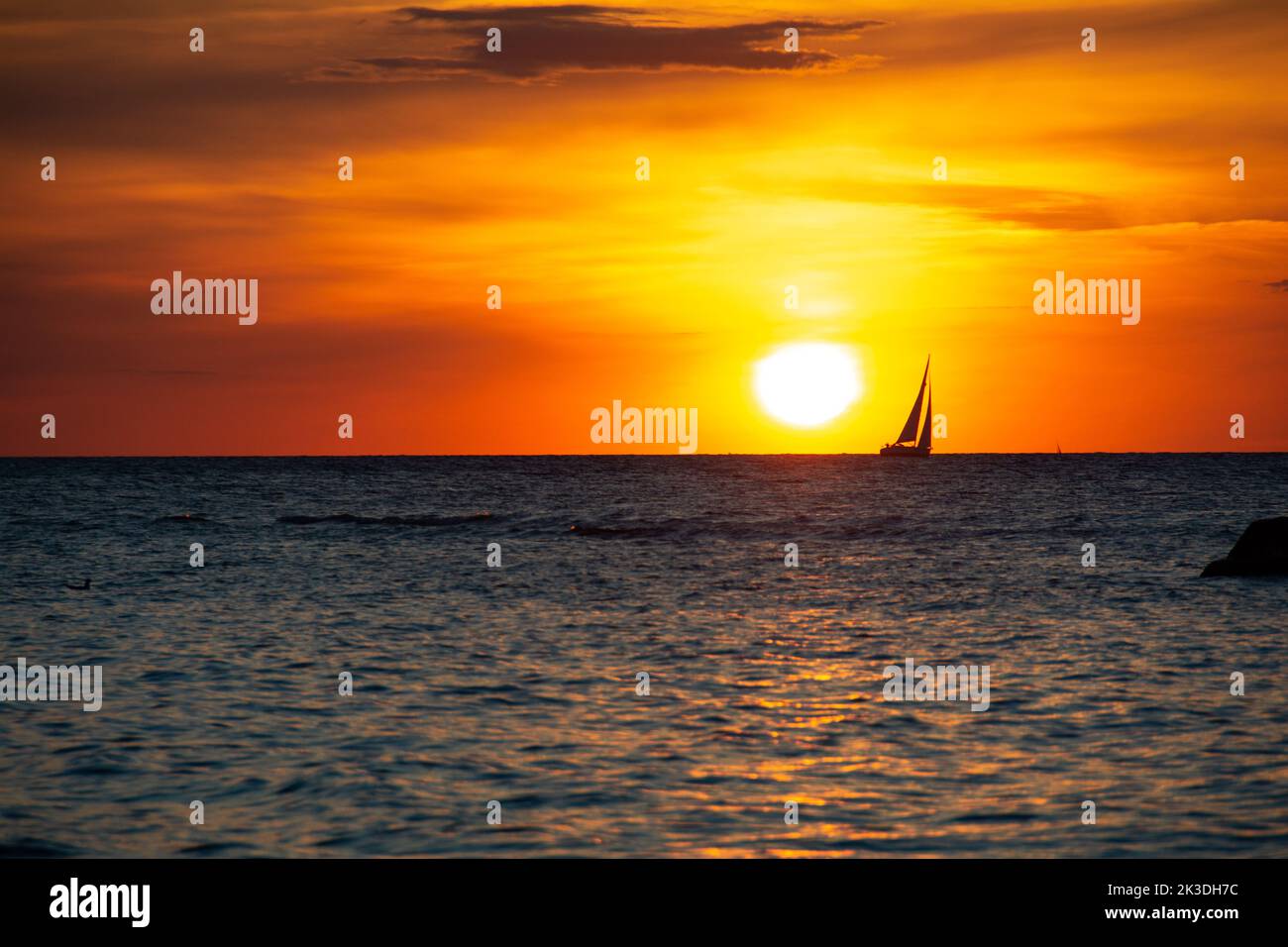 Beautiful orange sunset over the sea, a ship on the horizon Stock Photo ...