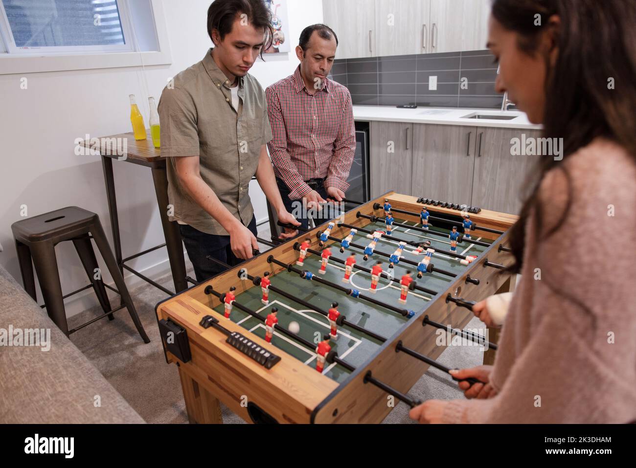 Family Playing Foosball