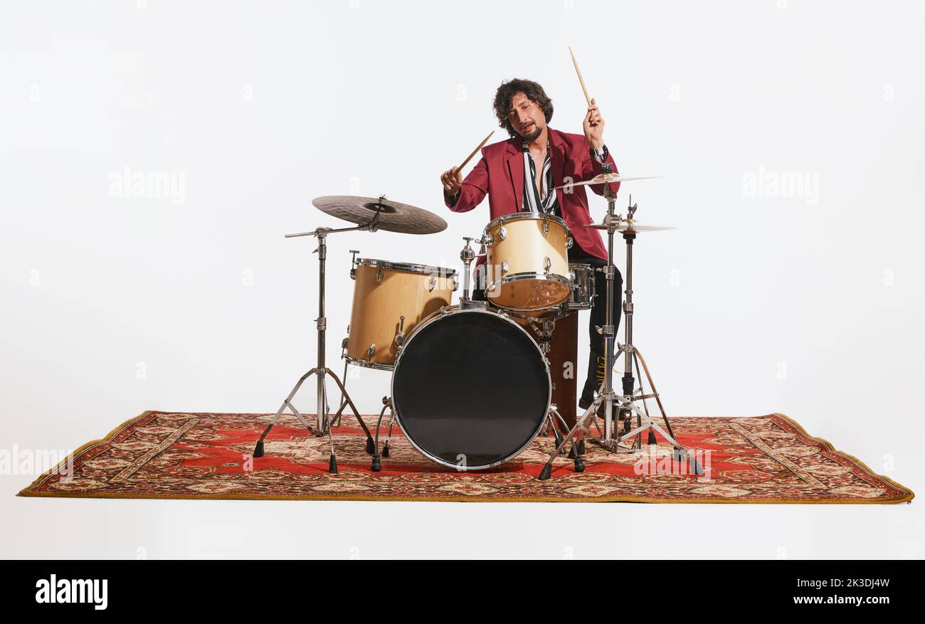 Music, beats, atmosphere. Young musician with drums performing over ...