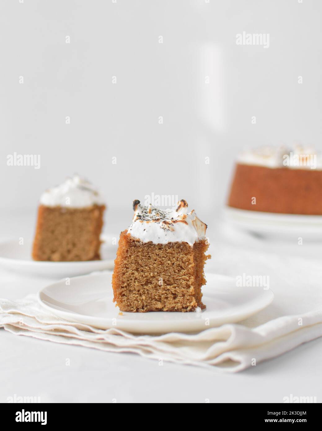 Sliced homemade bundt cake with a toasted meringue topping Stock Photo ...