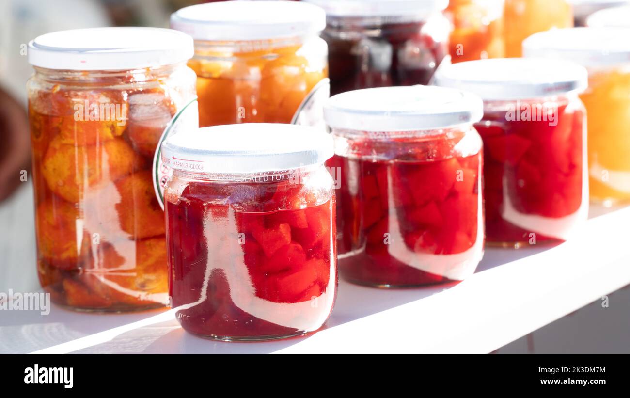 Glass jars with jam, canned sweet product Stock Photo - Alamy