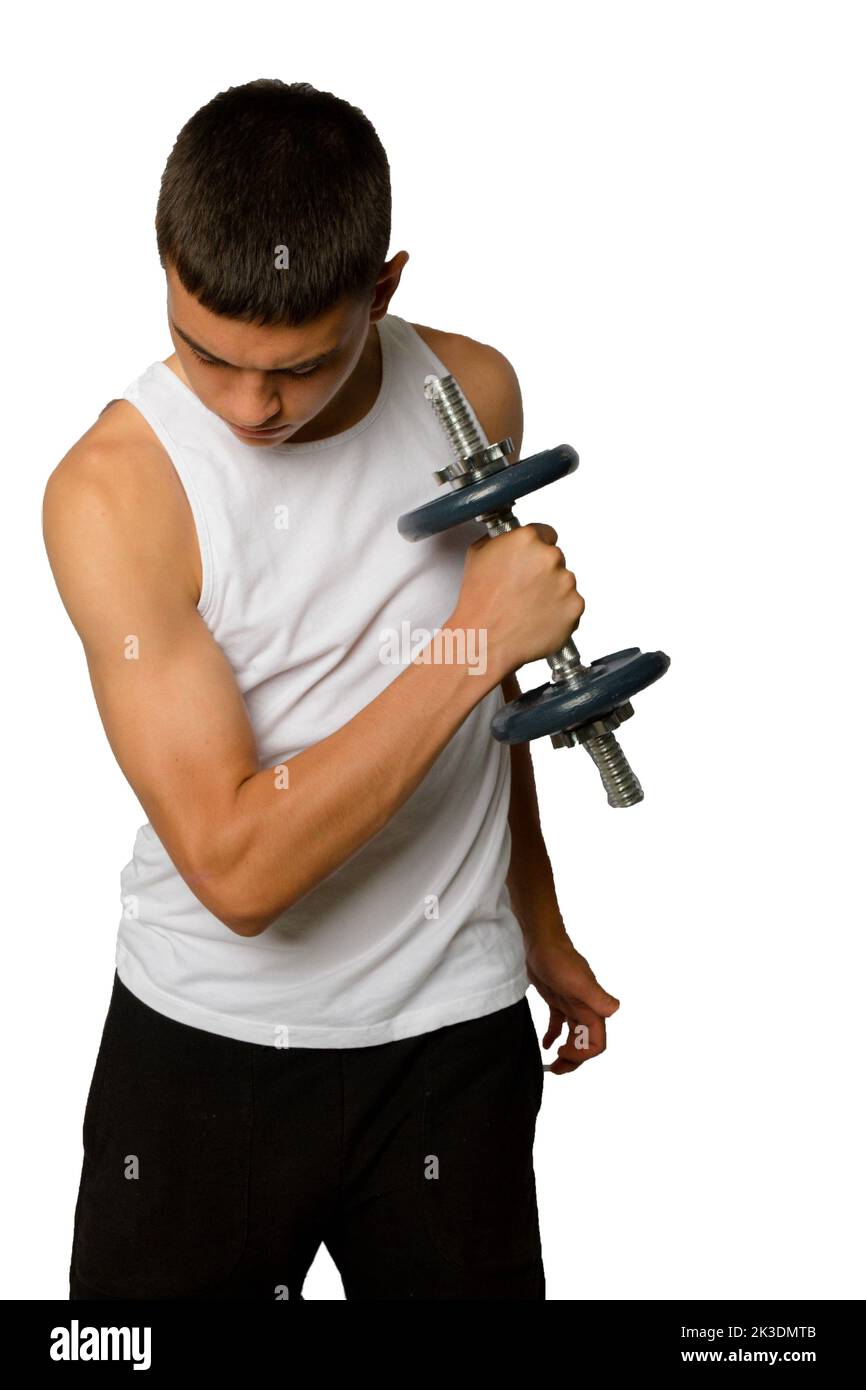 19 year old teenage boy in a tank top exercising his biceps Stock Photo ...
