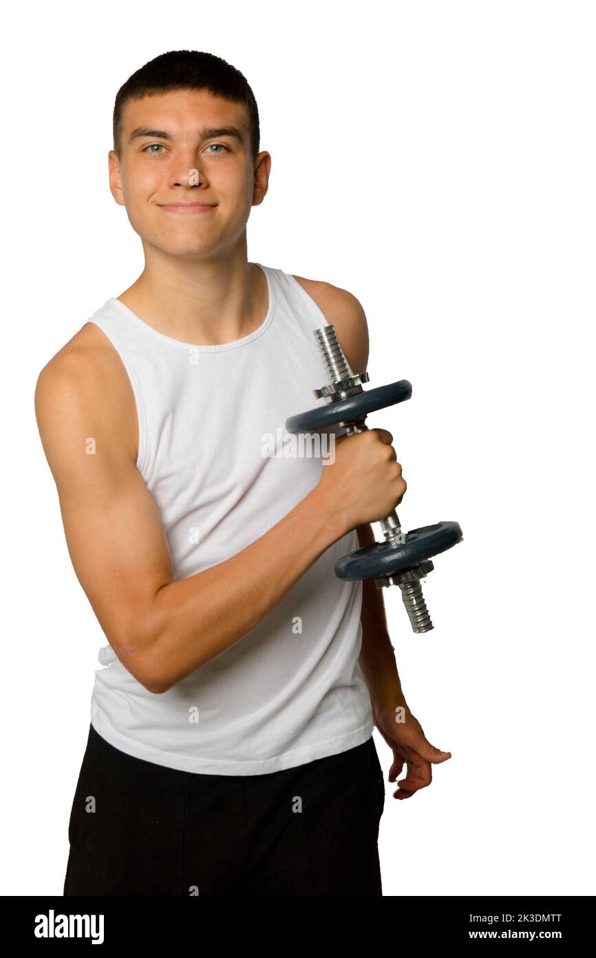 19 year old teenage boy in a tank top exercising his biceps Stock Photo ...