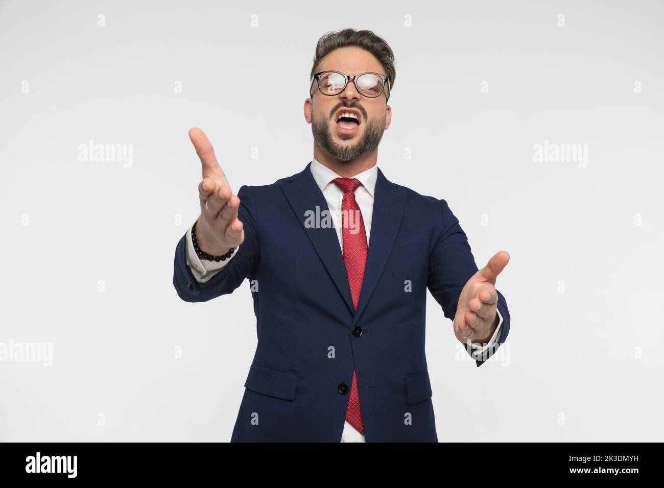 angry businessman with glasses holding hands and showing, arguing and ...