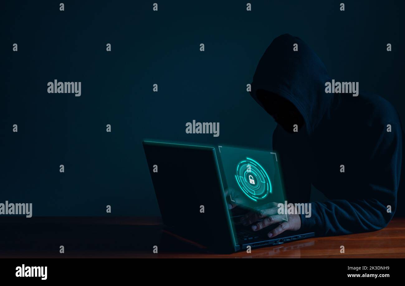 Hackers work on laptops in the dark. The concept of information ...