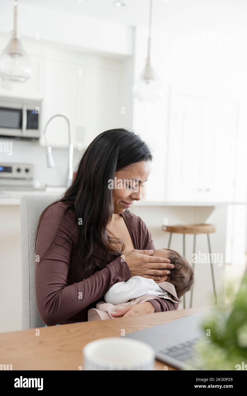 Woman breastfeeding her baby hi-res stock photography and images - Alamy