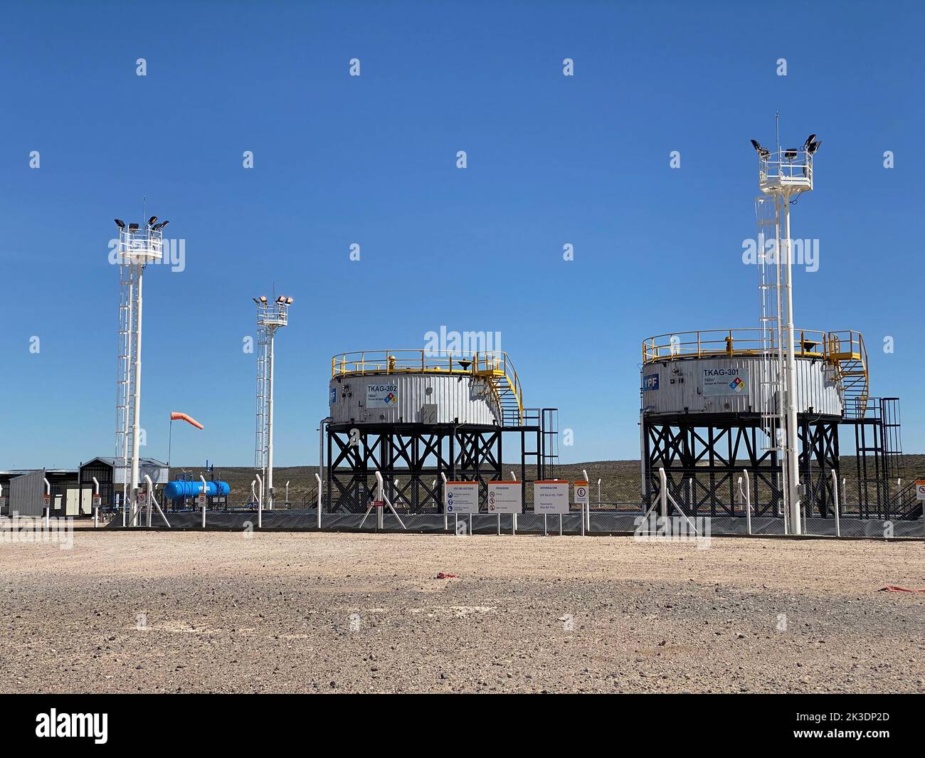 Argentina, Neuquen Province, Vaca Muerta, Oil and water storage tanks ...