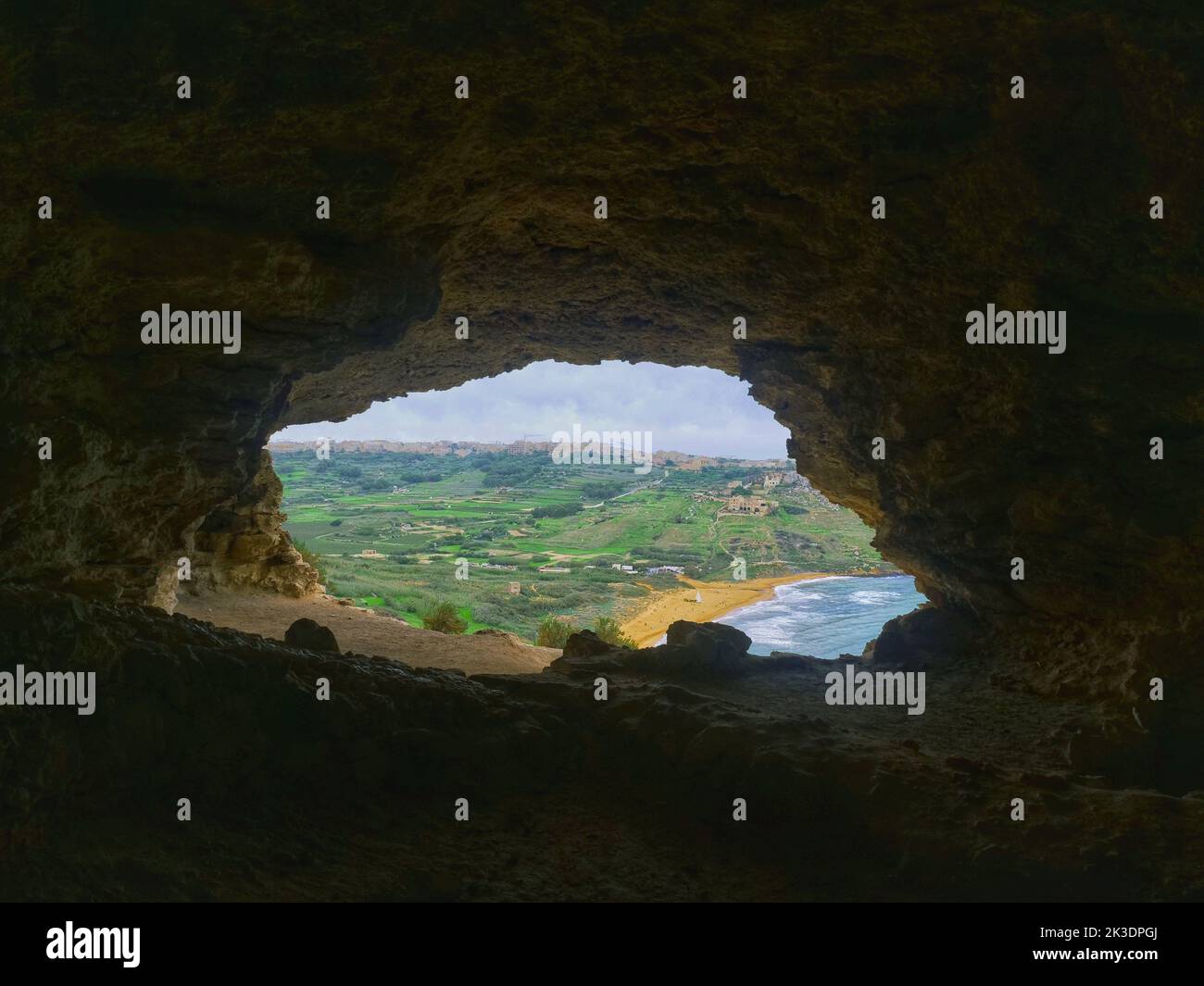 A view of the beach from the Mixta cave of Gozo island in Malta Stock ...