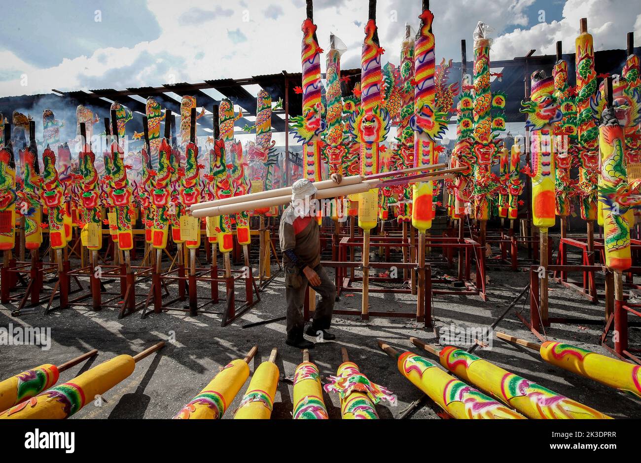 Kuala Lumpur, Malaysia. 26th Sep, 2022. A temple worker seen carrying ...