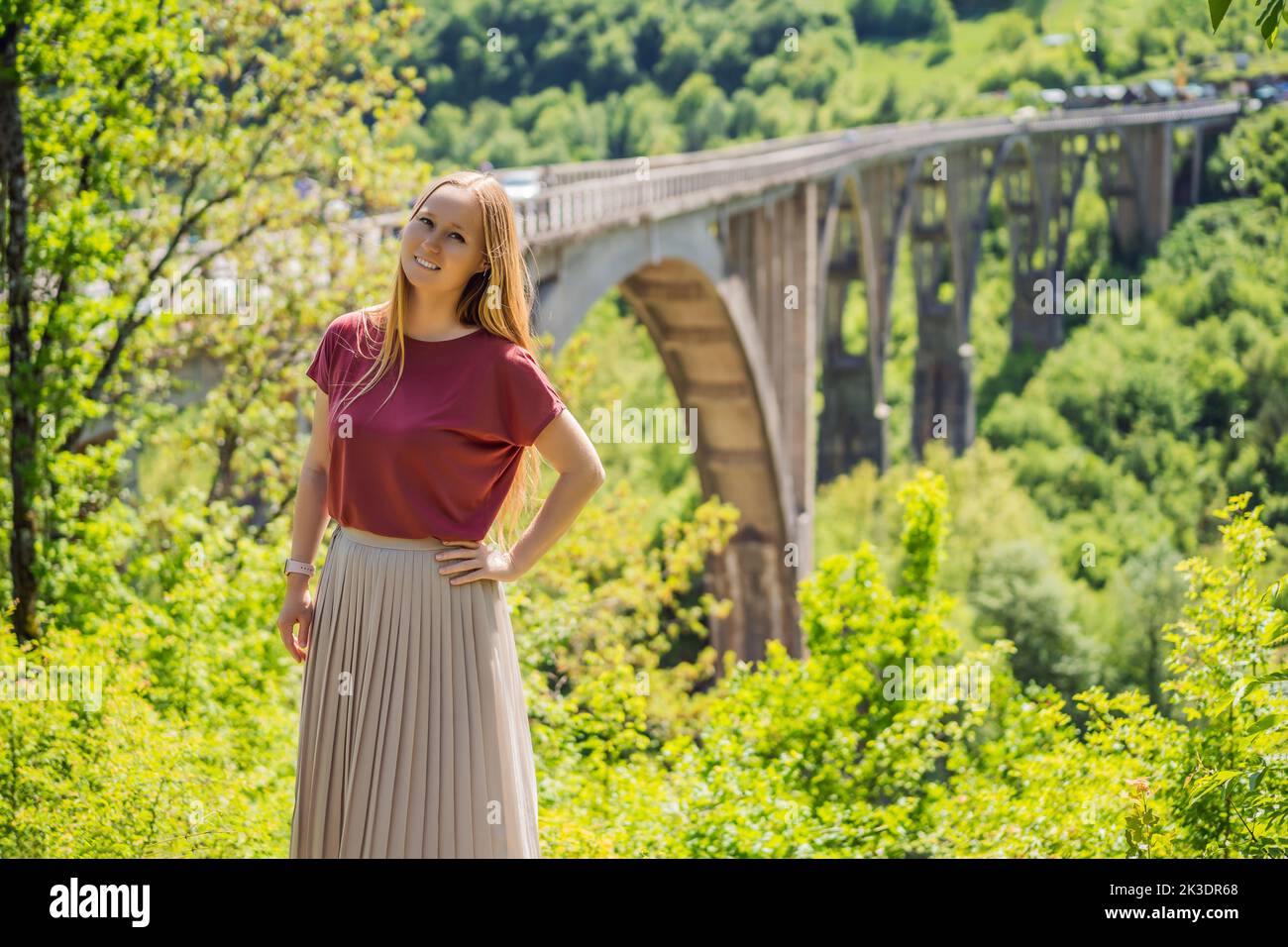 Montenegro. Woman tourist in background of Dzhurdzhevich Bridge Over ...