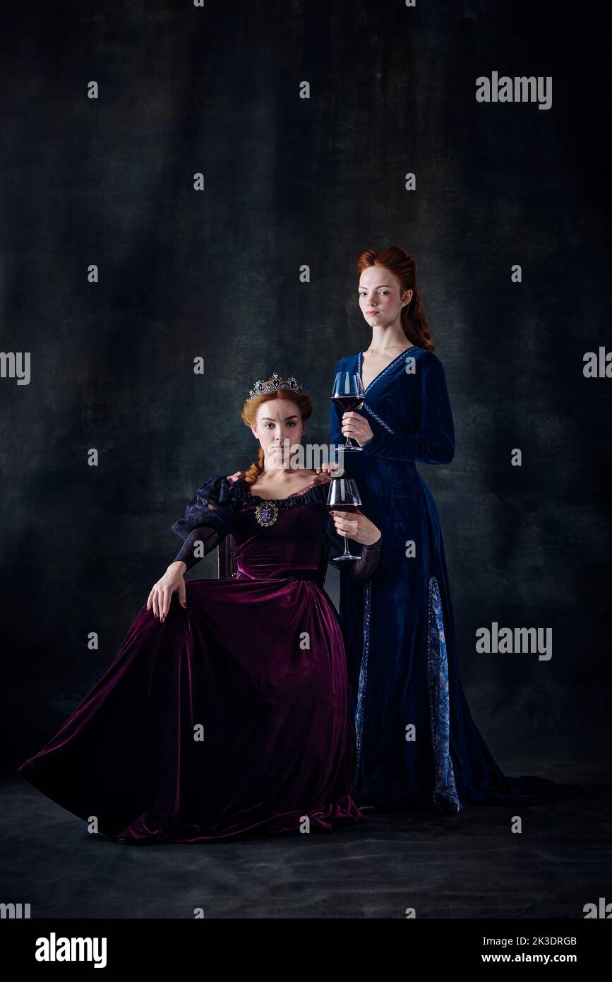 Portrait of two beautiful women in image of royal persons, queen and ...