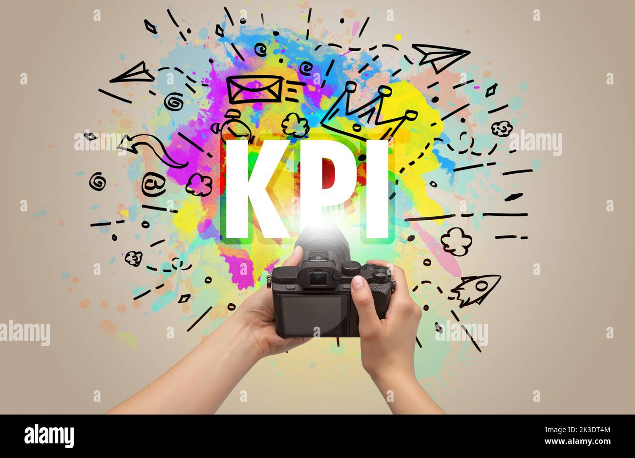 Close-up of a hand holding digital camera with abstract drawing Stock ...