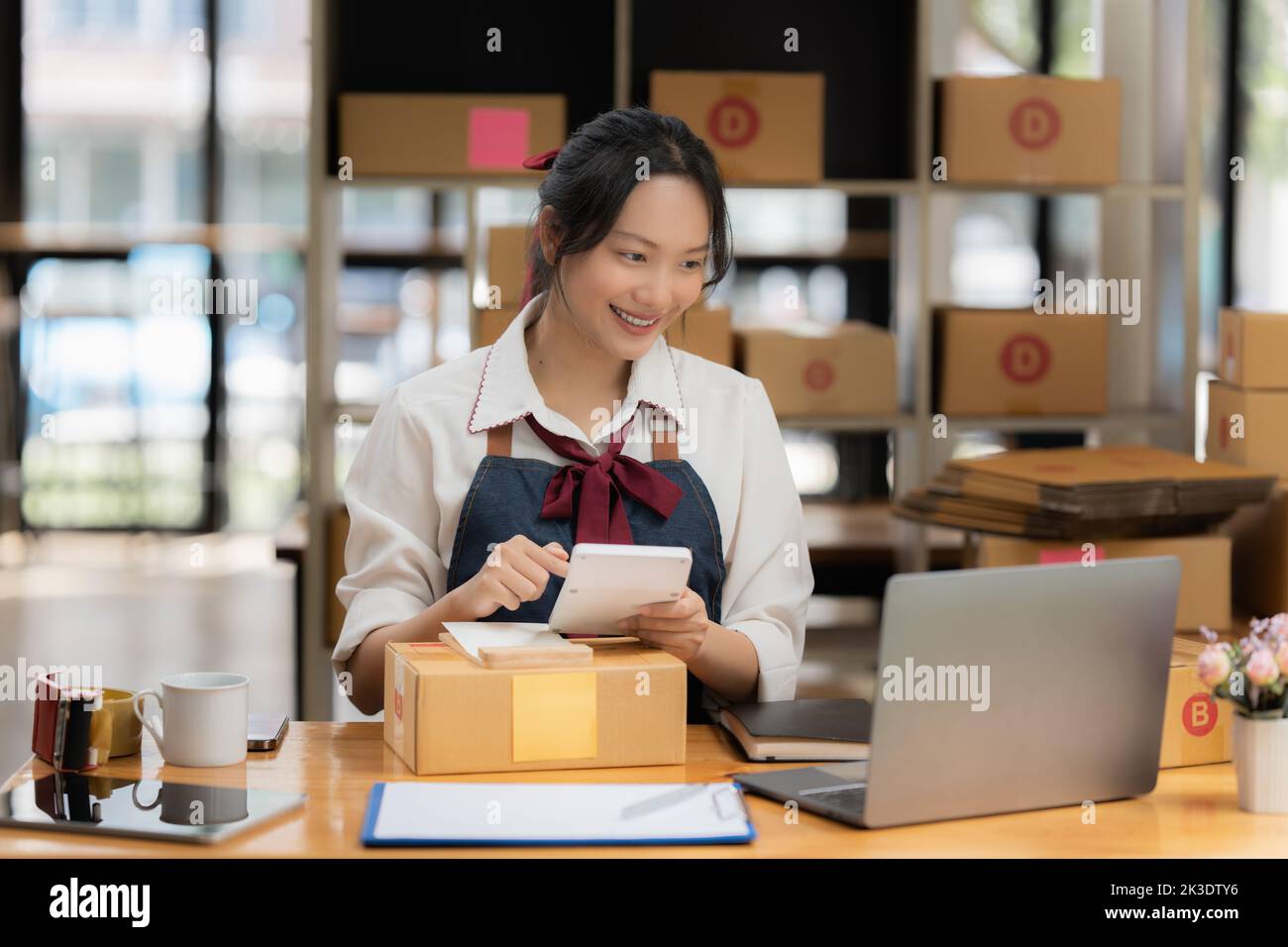 Asian small business owner working at home office. Business retail ...