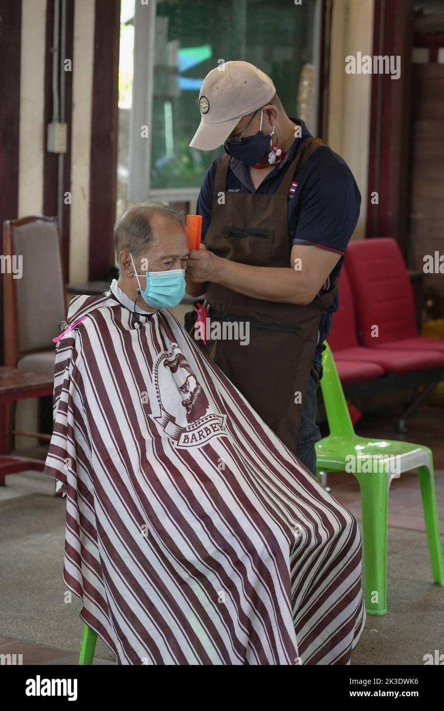 Thailand, Bangkok, Man receiving a hair cut at a barbers Stock Photo ...