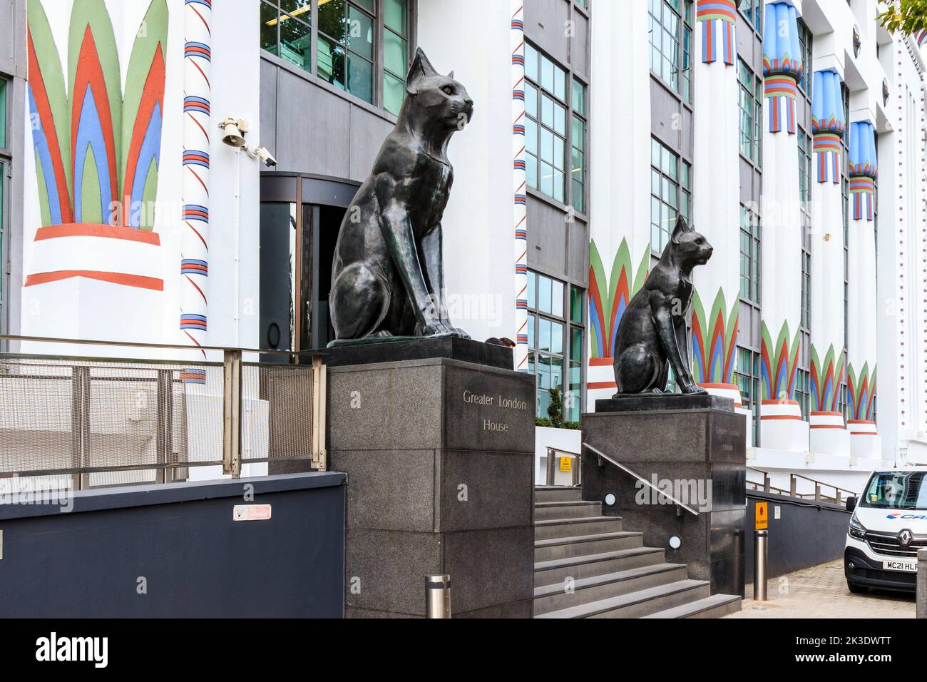 Black cats on guard at Greater London House, a large Art Deco building ...