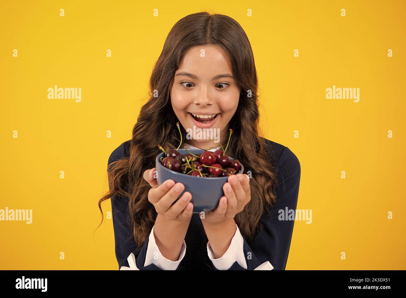 Excited face. Cherry for kids. Teenager child girl hold plate cherries ...