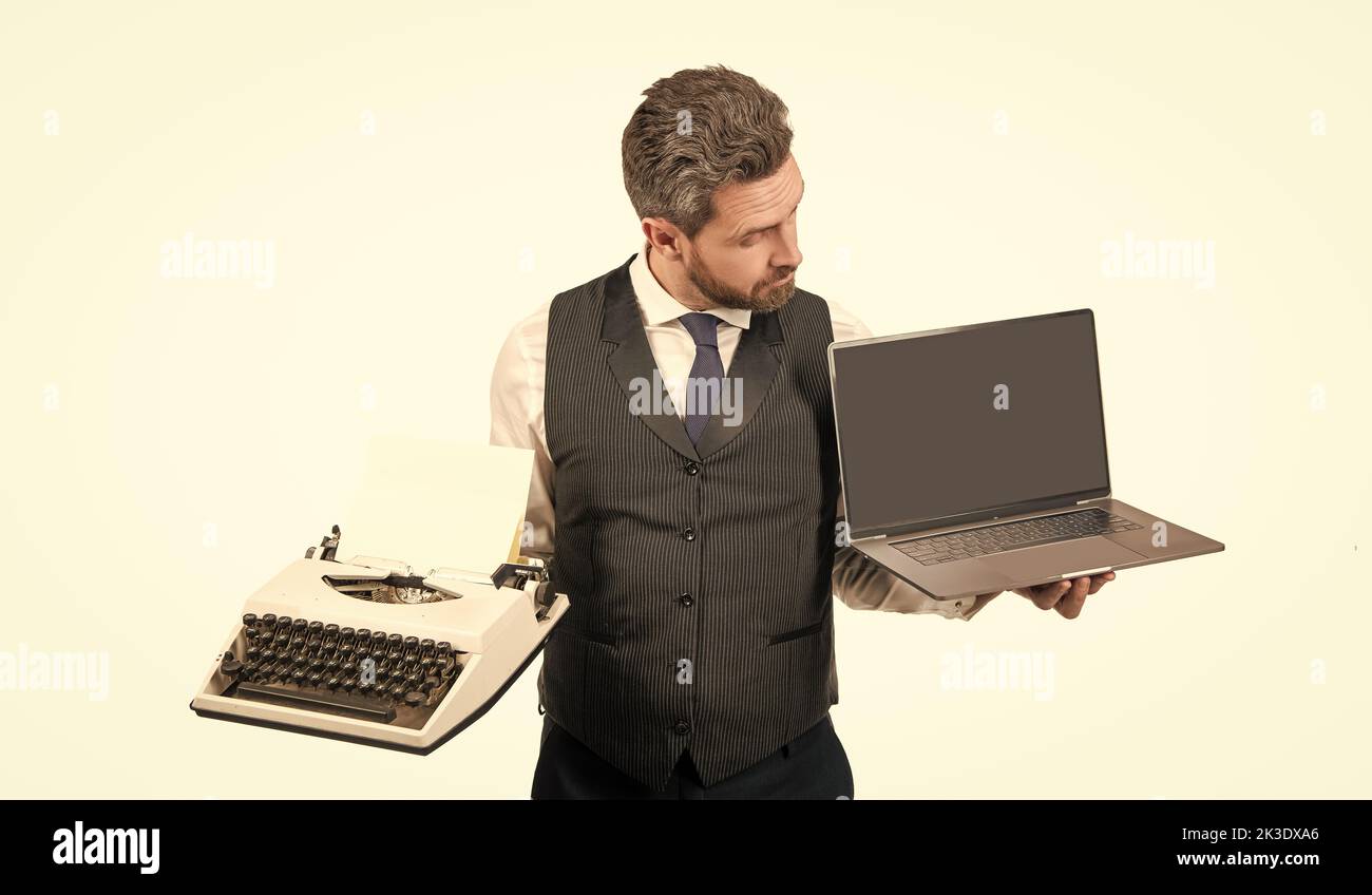 curious man showing pc and typewriter isolated on white background ...