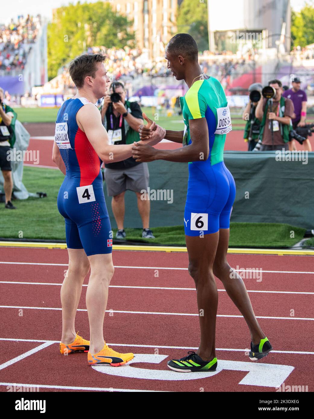 Karsten Warholm of Norway congratulates Alison Dos Santos of Brazil of ...