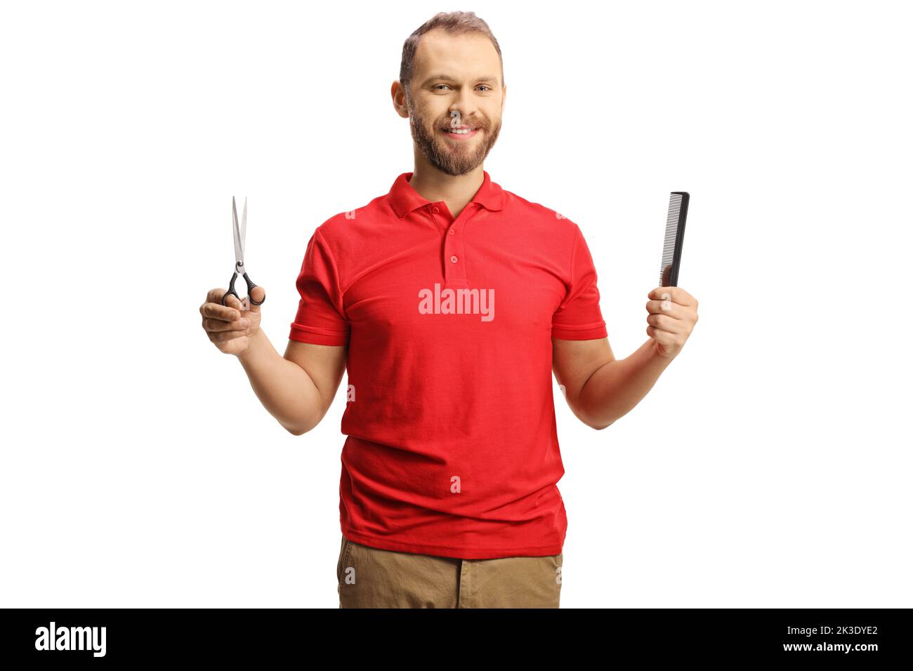Man holding scissors and a hair comb isolated on white background Stock ...
