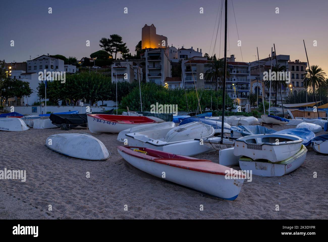 Blue hour and morning dawn in Sant Pol de Mar with boats on the beach ...