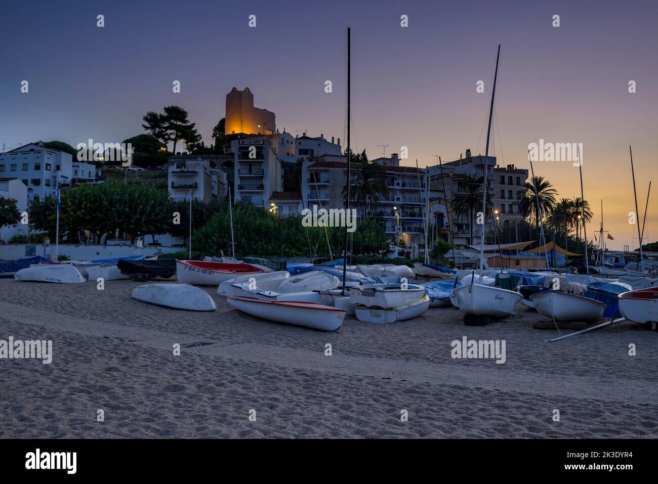 Blue hour and morning dawn in Sant Pol de Mar with boats on the beach ...