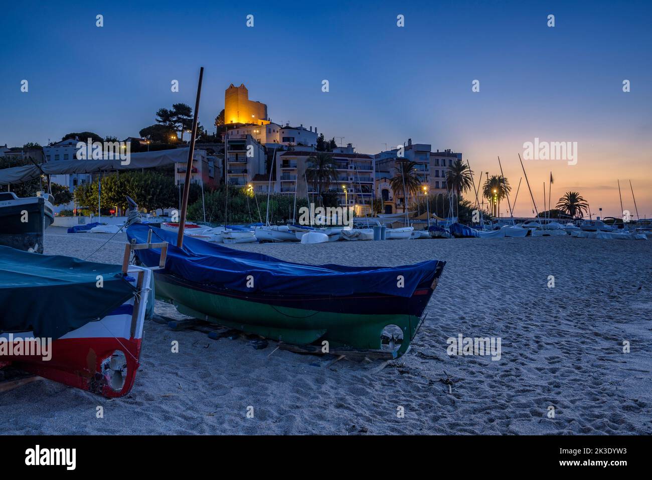 Blue hour and morning dawn in Sant Pol de Mar with boats on the beach ...