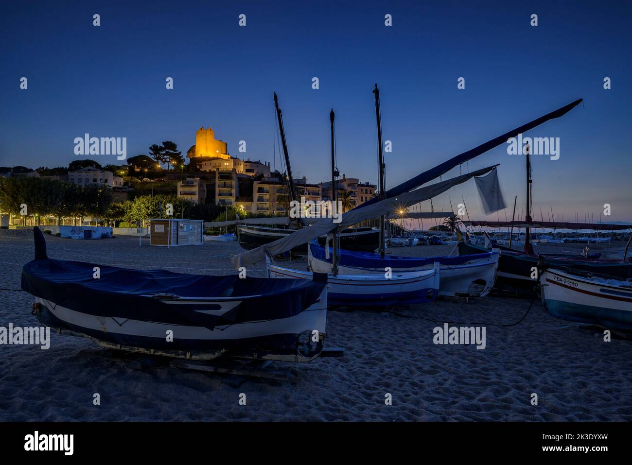 Blue hour and morning dawn in Sant Pol de Mar with boats on the beach ...