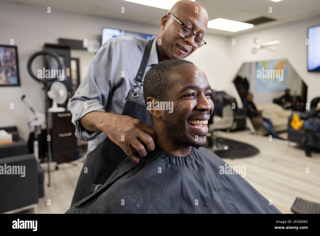 Happy owner laughing hi-res stock photography and images - Alamy