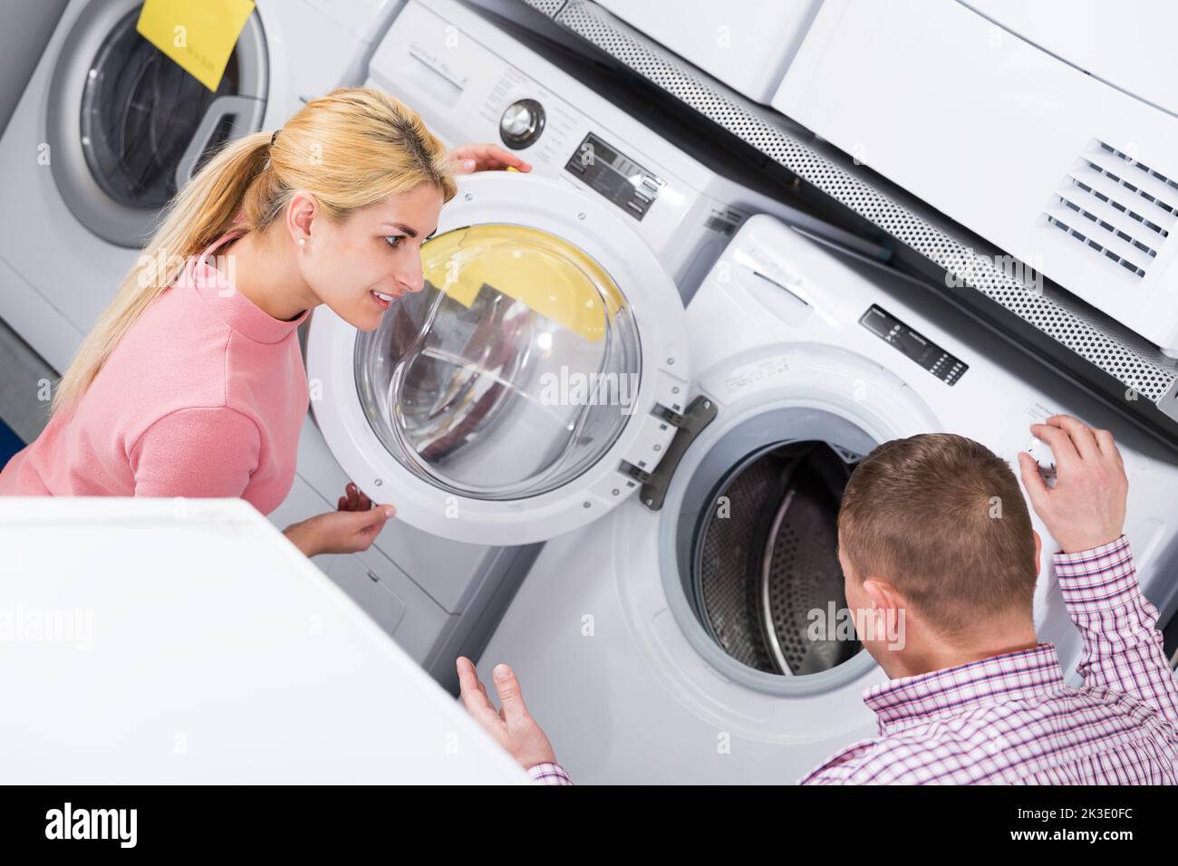 Family choosing washing machine Stock Photo - Alamy