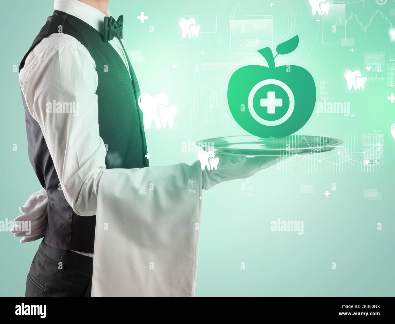 Handsome young waiter in tuxedo holding healthcare icons on tray Stock ...