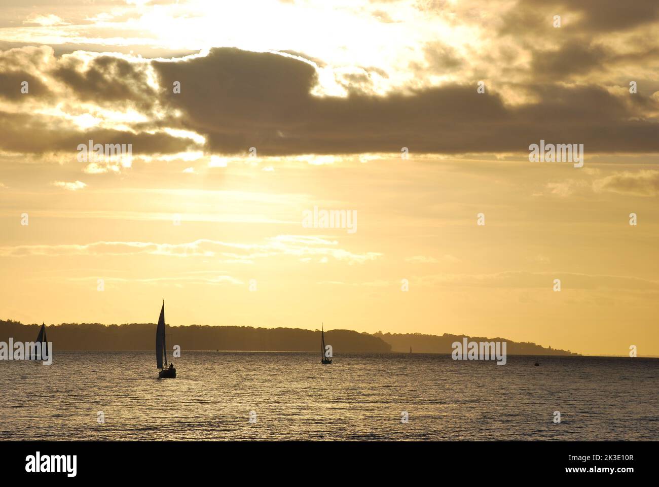 Beautiful sunset seen from Stokes Bay beach with isle view Stock Photo ...