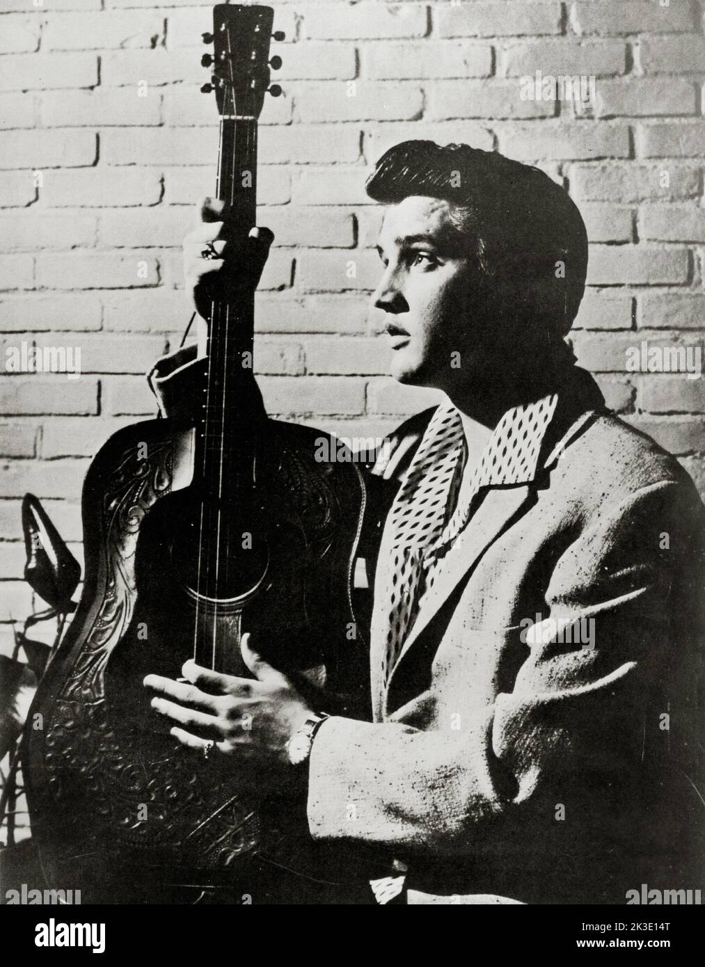 Elvis Presley holds an acoustic guitar, Circa 1955. (THA File Reference ...