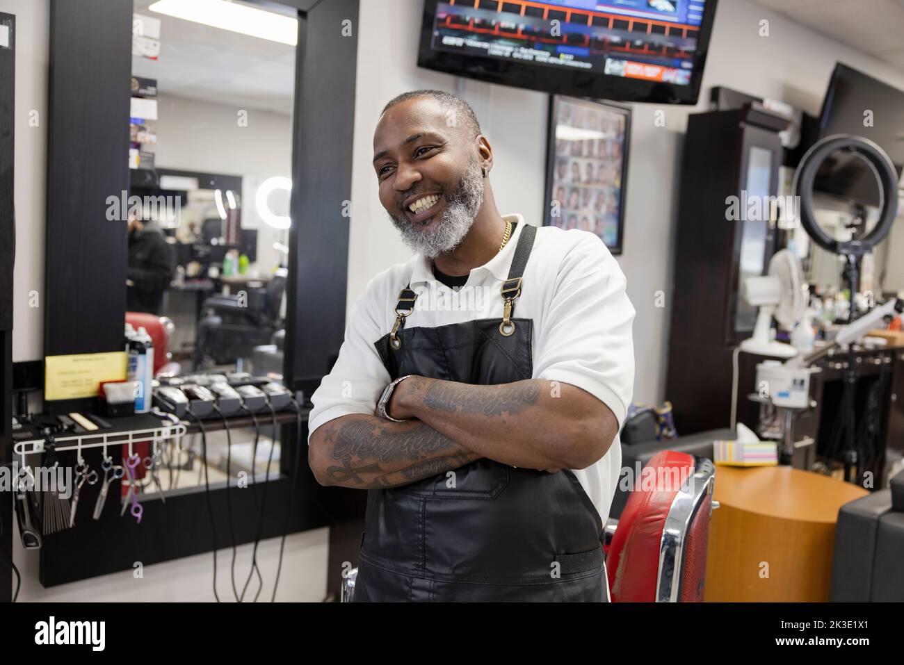 Portrait happy, smiling barber with tattoos and arms crossed Stock ... Portrait happy, smiling barber with tattoos and arms crossed Stock ...