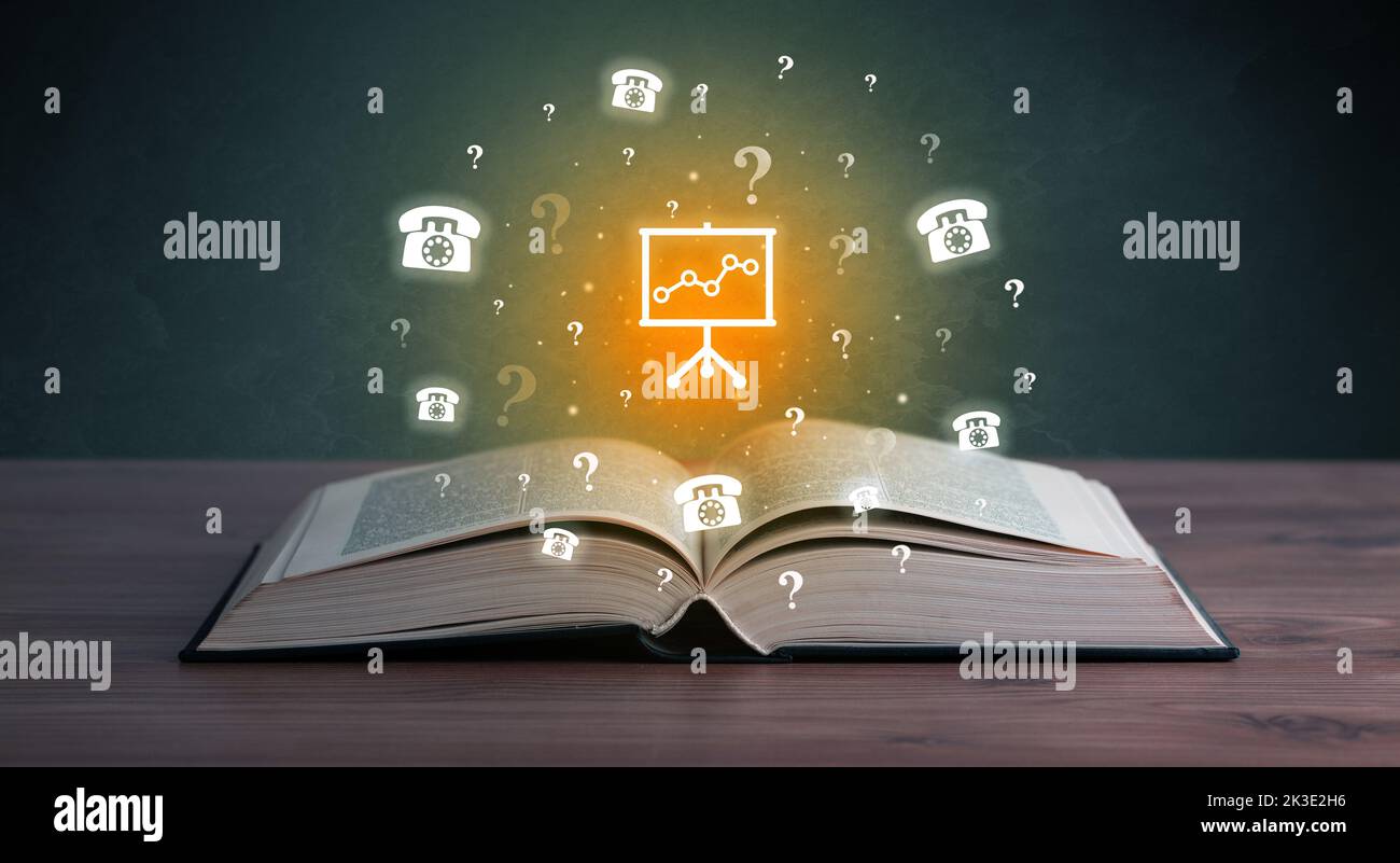Open book with business icons above Stock Photo - Alamy