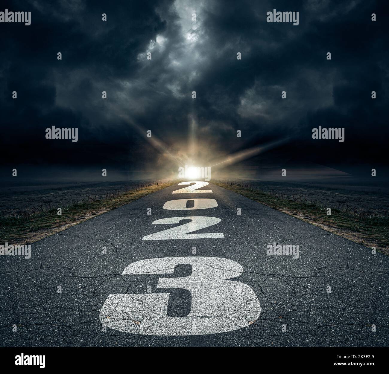 2023 written on highway road in the middle of asphalt road and dark ...