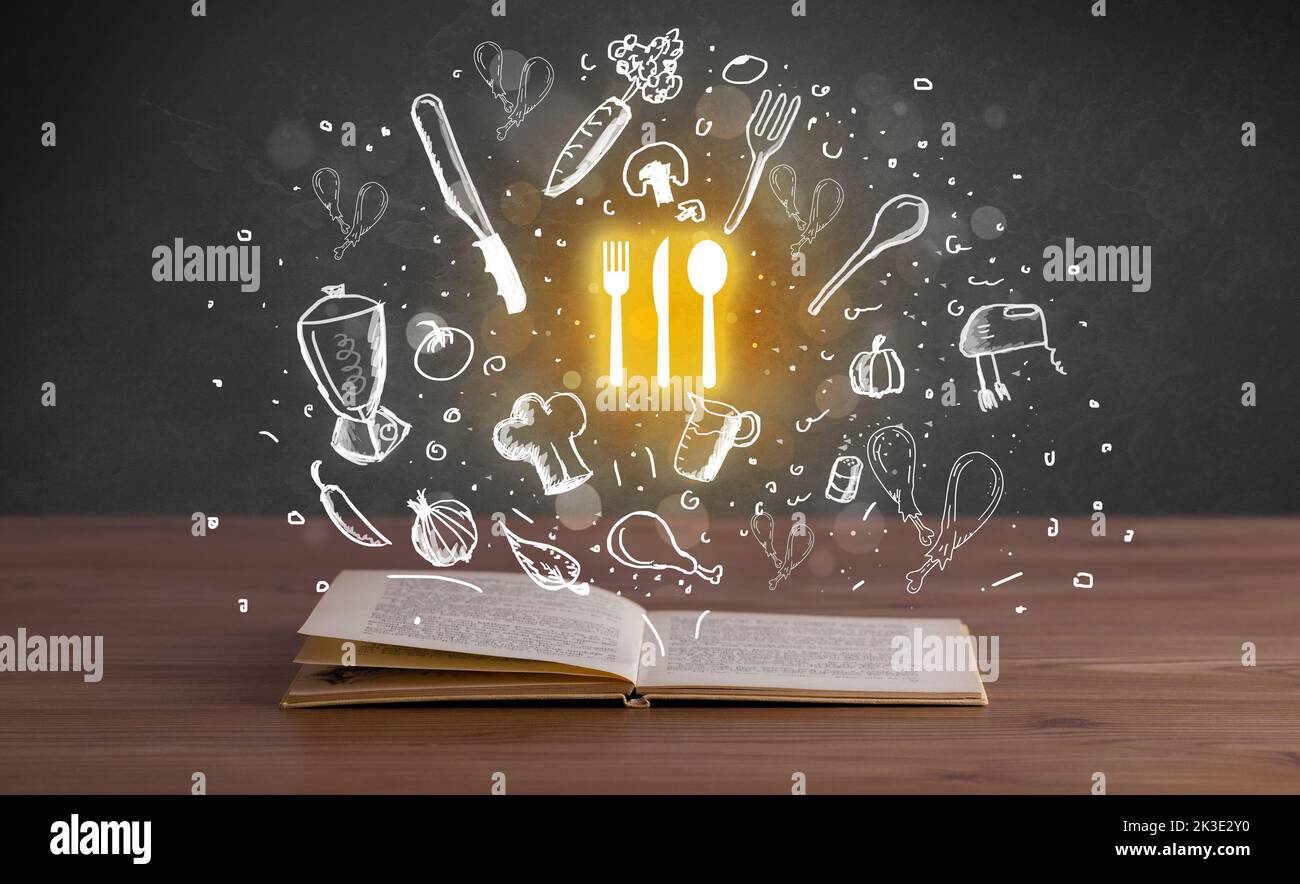 Open recipe book with food related icons above Stock Photo - Alamy