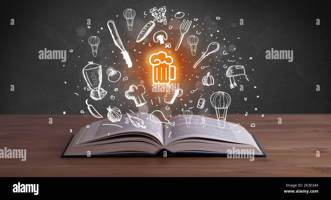 Open recipe book with food related icons above Stock Photo - Alamy