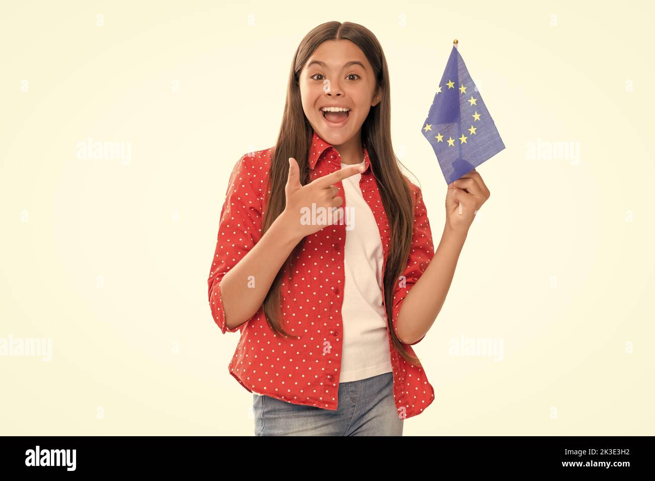 happy teen girl pointing finger on european union flag. schengen ...