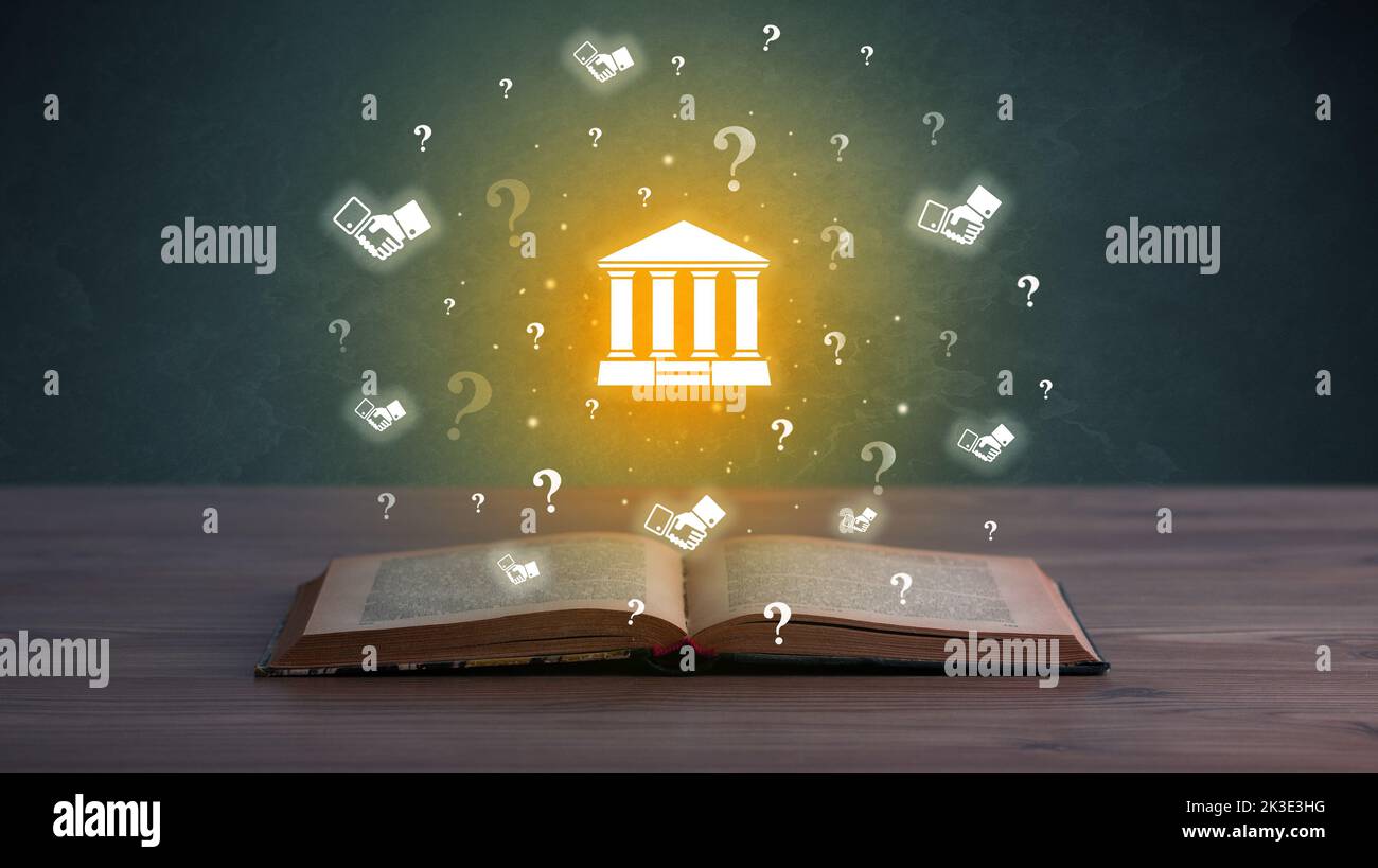 Open book with business icons above Stock Photo - Alamy