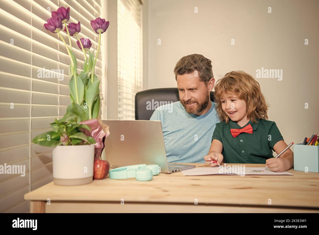 father and kid boy use computer at home. family and parenthood blog ...