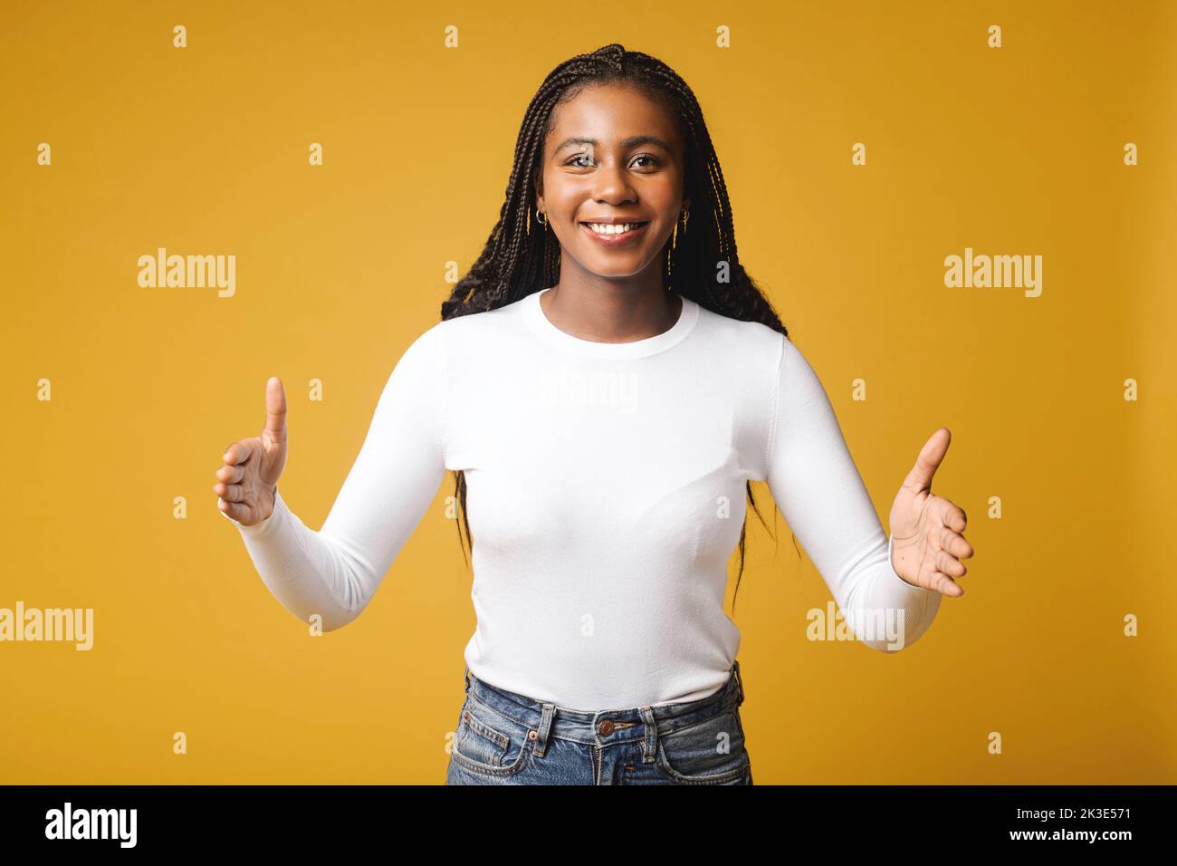 Multiracial woman showing with hands length, measure symbol isolated on ...