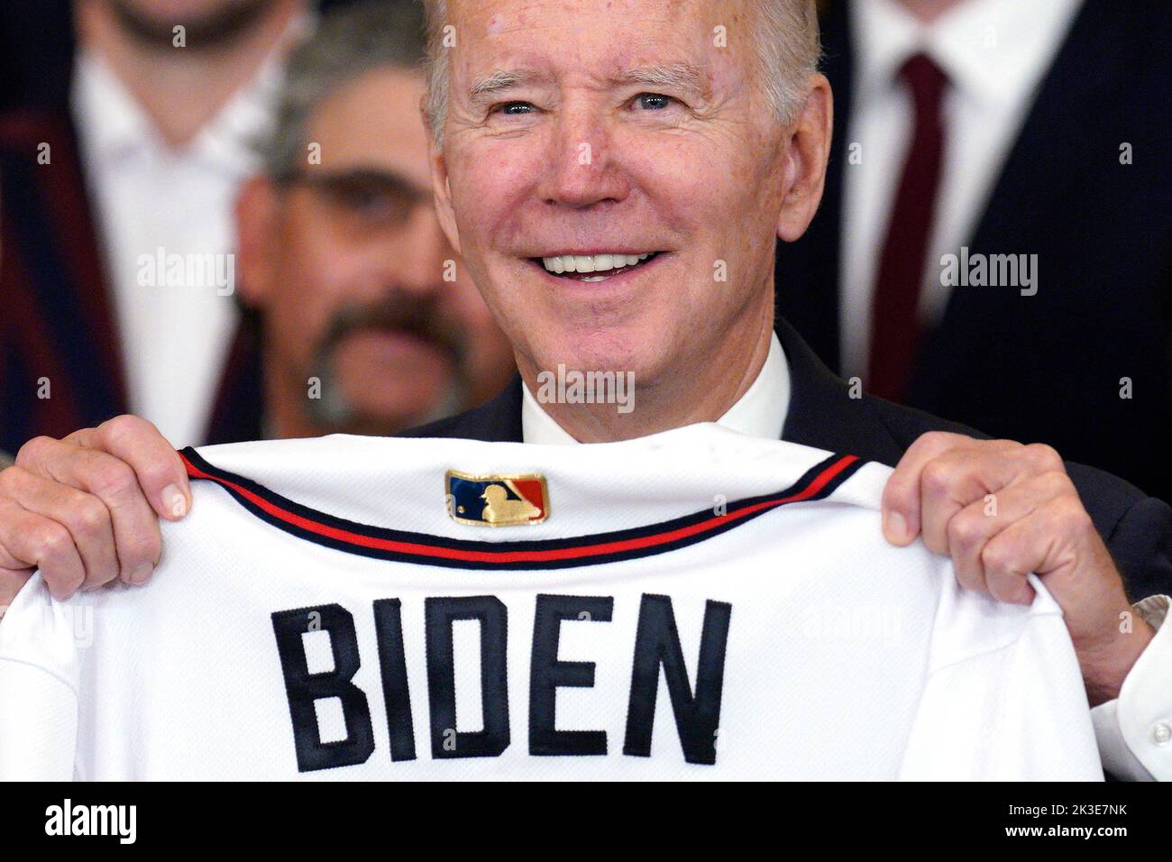 U.S. President Joe Biden is presented a jersey as he welcomes the ...