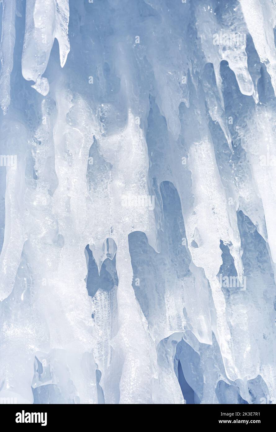 Blue ice and icicles on the rocks of Ogoy island, Baikal lake, Siberia ...