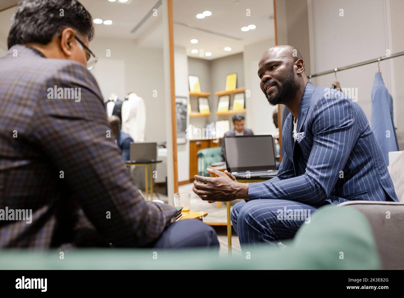Black men suits talking hi-res stock photography and images - Alamy