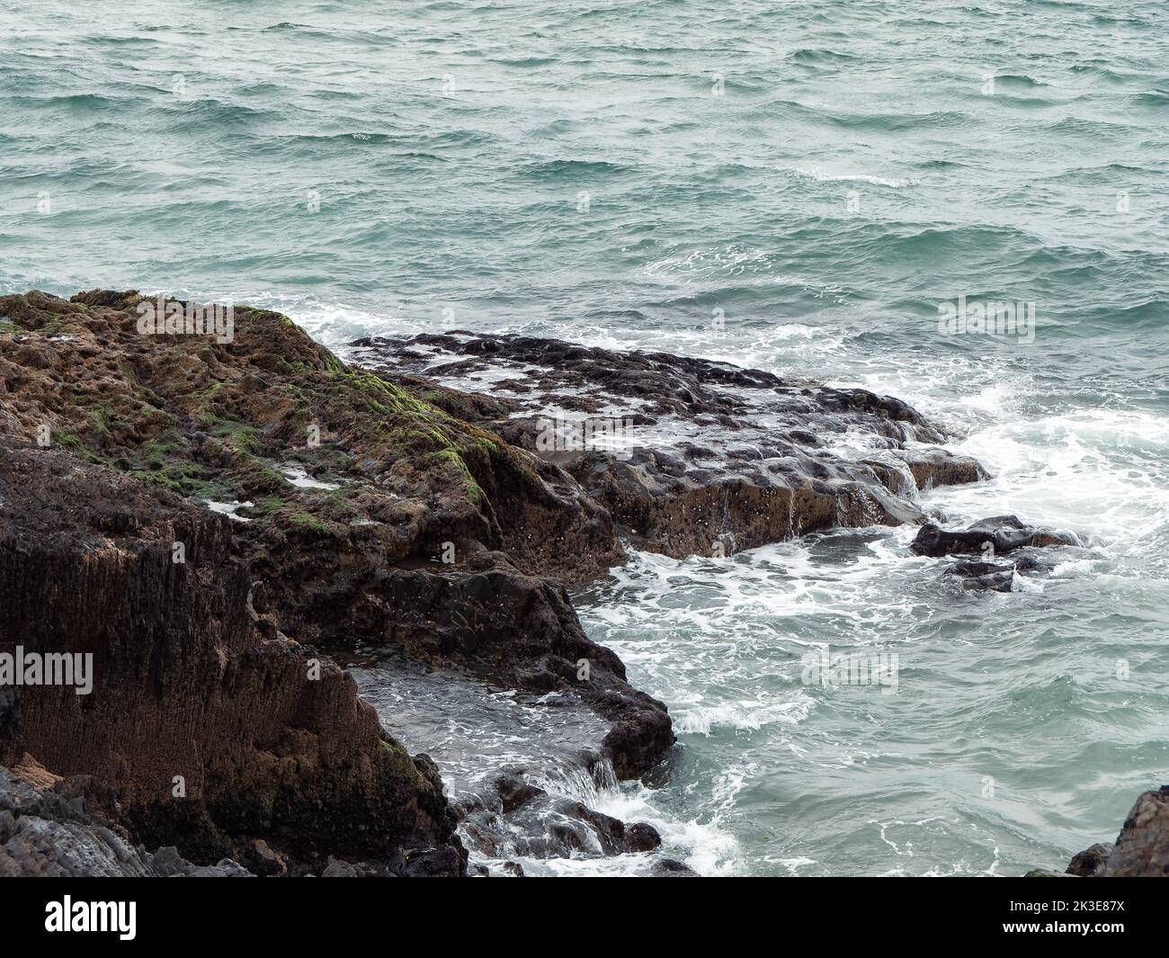 Wild rocks and sea water, landscape, rock formation beside body of ...