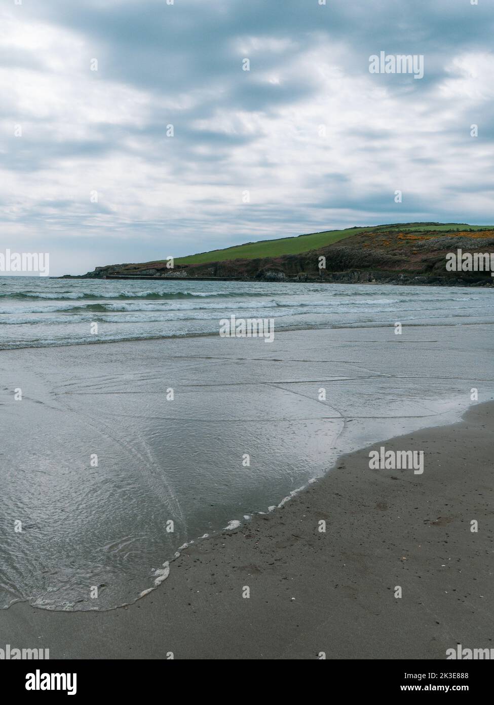 View of Rosscarbery pier from Warren Beach, southern coast of Ireland ...
