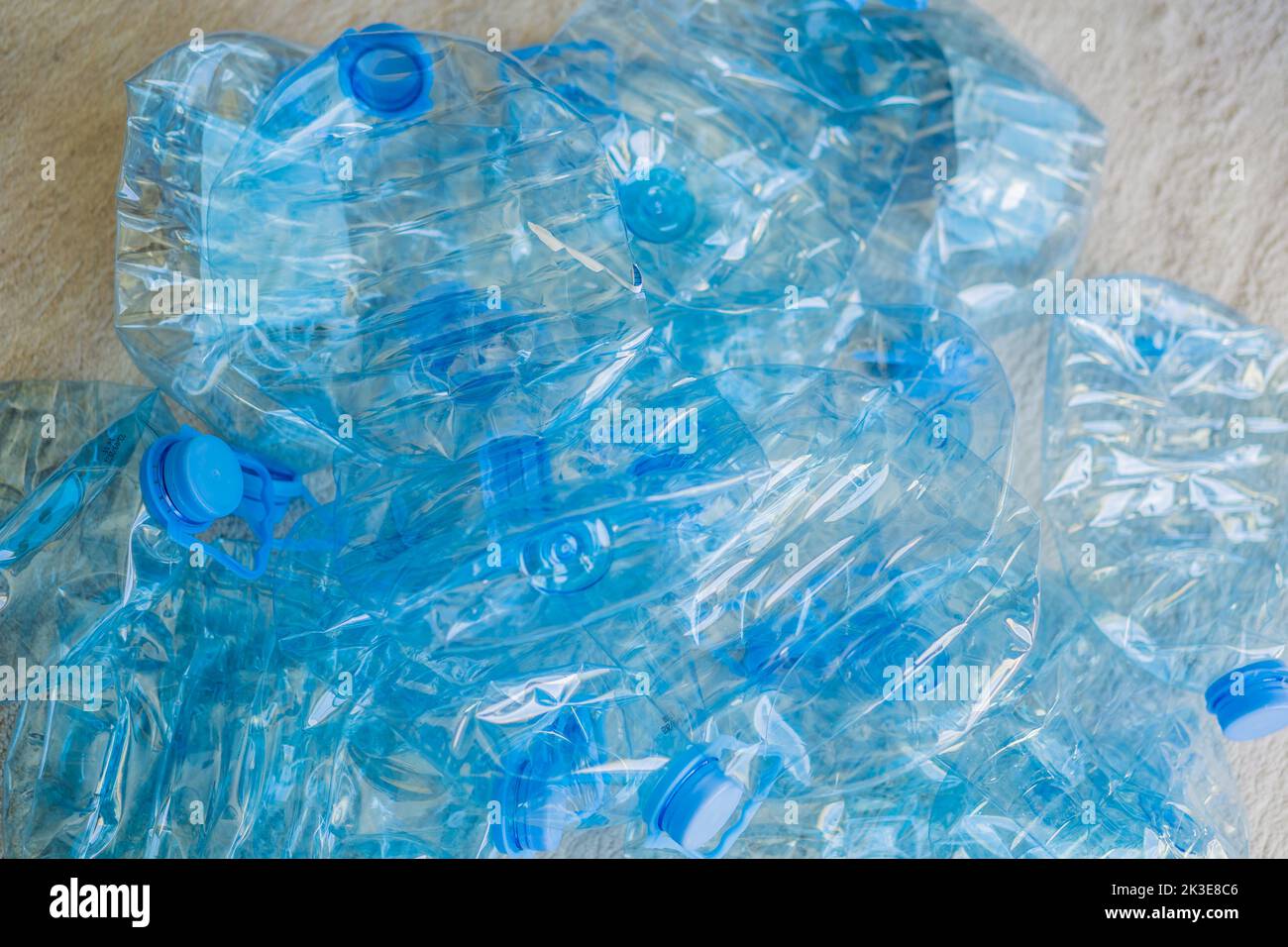 Large stack of old plastic bottles on the floor Stock Photo - Alamy