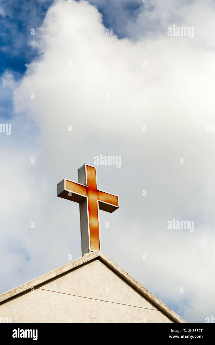 Faded red cross on church roof Stock Photo - Alamy