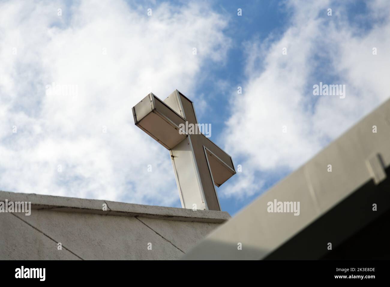 Faded red cross on church roof Stock Photo - Alamy