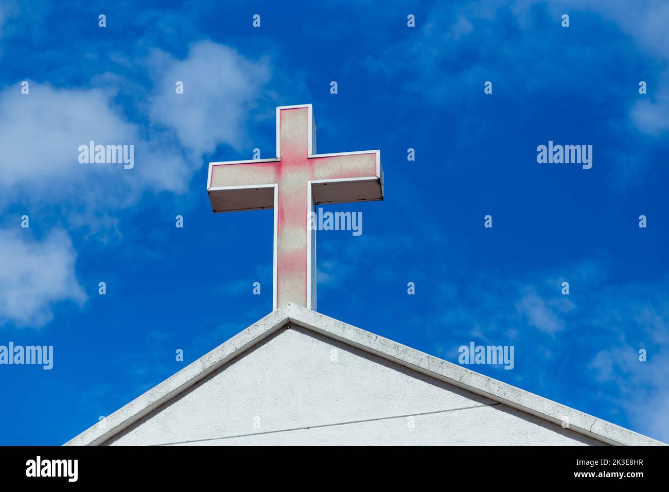 Faded red cross on church roof Stock Photo - Alamy